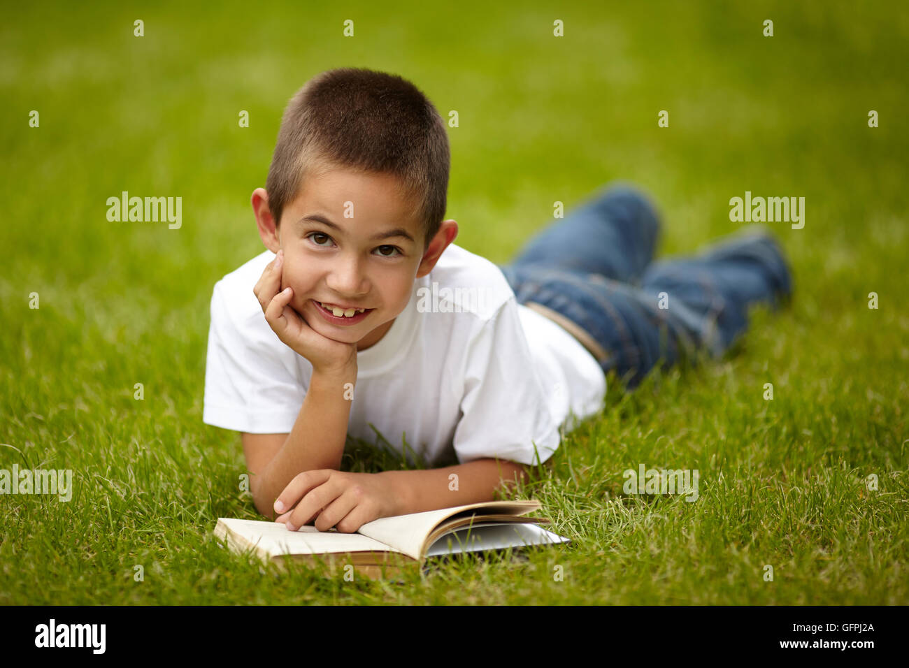 little happy boy reading book Stock Photo - Alamy