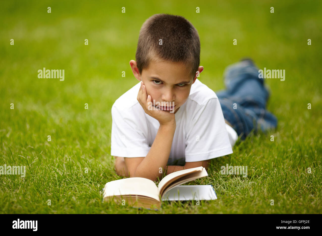 little happy boy reading book Stock Photo - Alamy