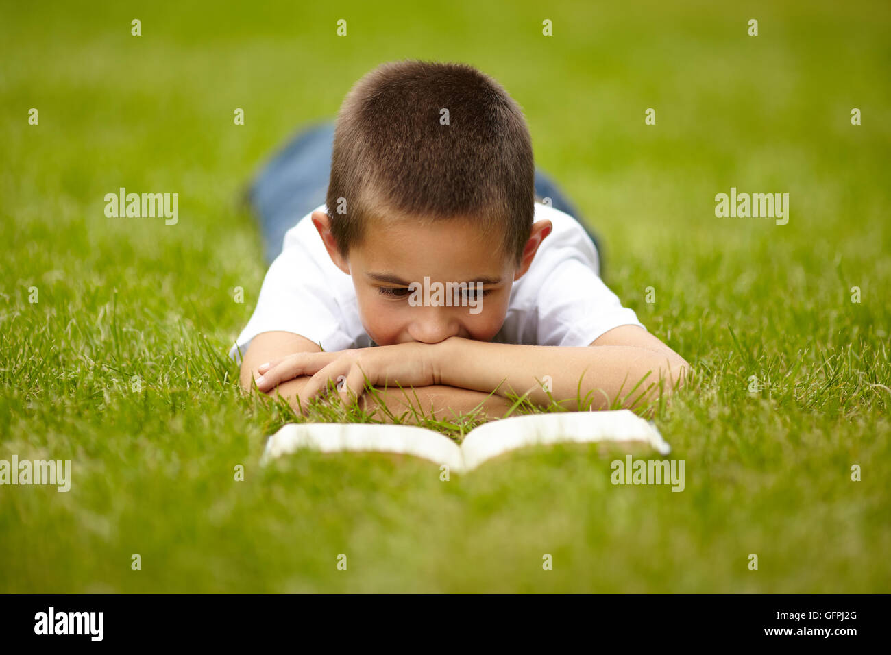little happy boy reading book Stock Photo - Alamy