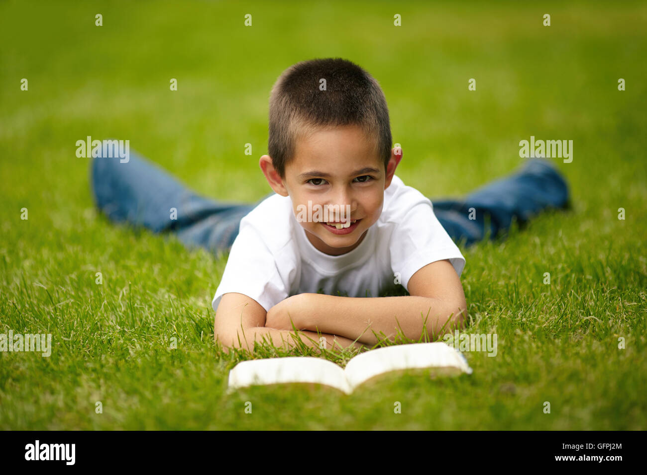 little happy boy reading book Stock Photo - Alamy