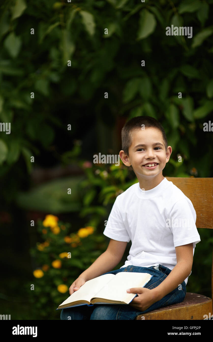 little happy boy reading book Stock Photo - Alamy
