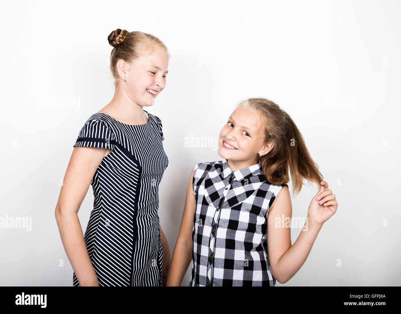 Two cute little girlfriend expressing different emotions. Funny kids ...