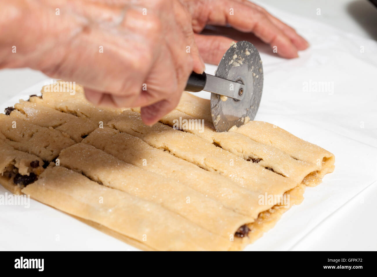 Cutting coconut filled sticks Stock Photo - Alamy