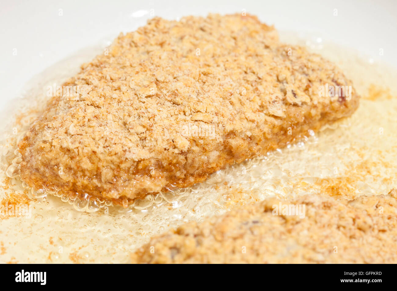 Frying a cordon bleu Stock Photo - Alamy