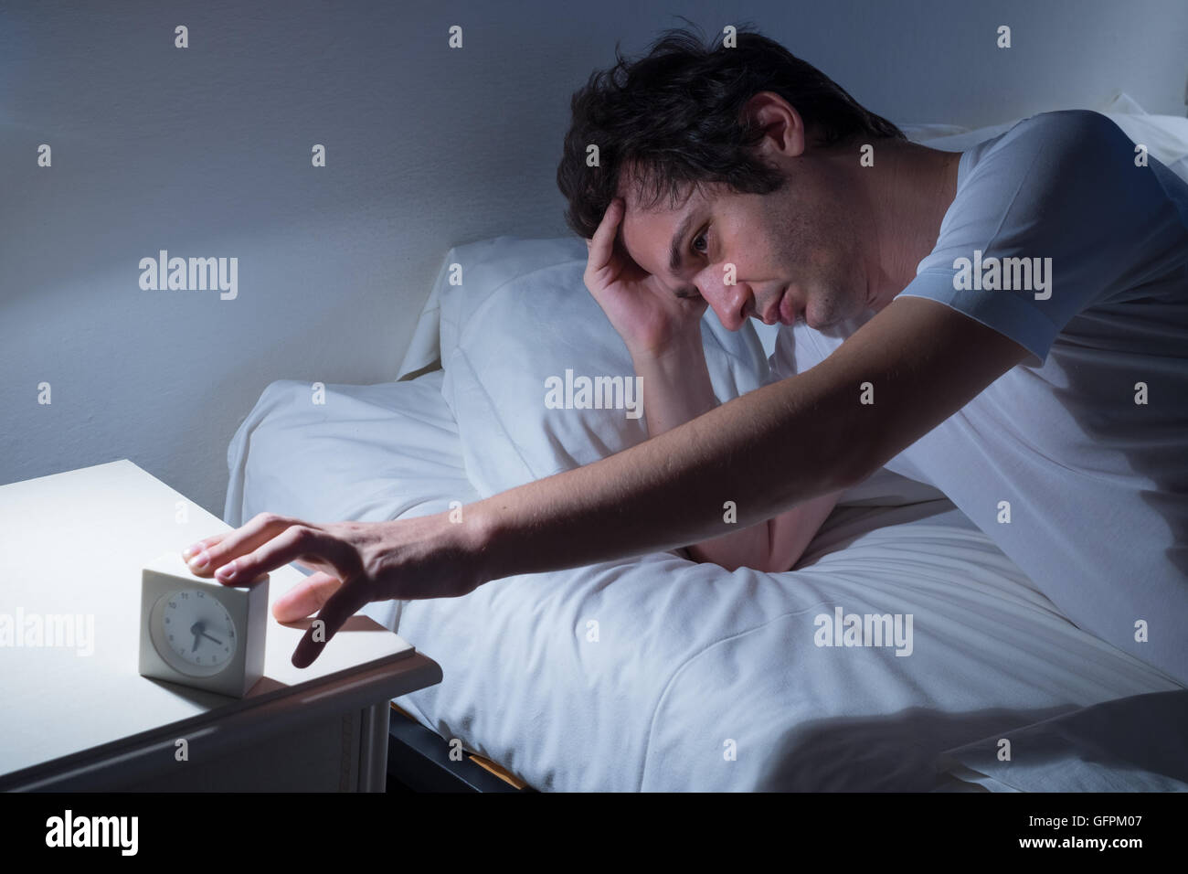 Man alarm clock bed hi-res stock photography and images - Alamy