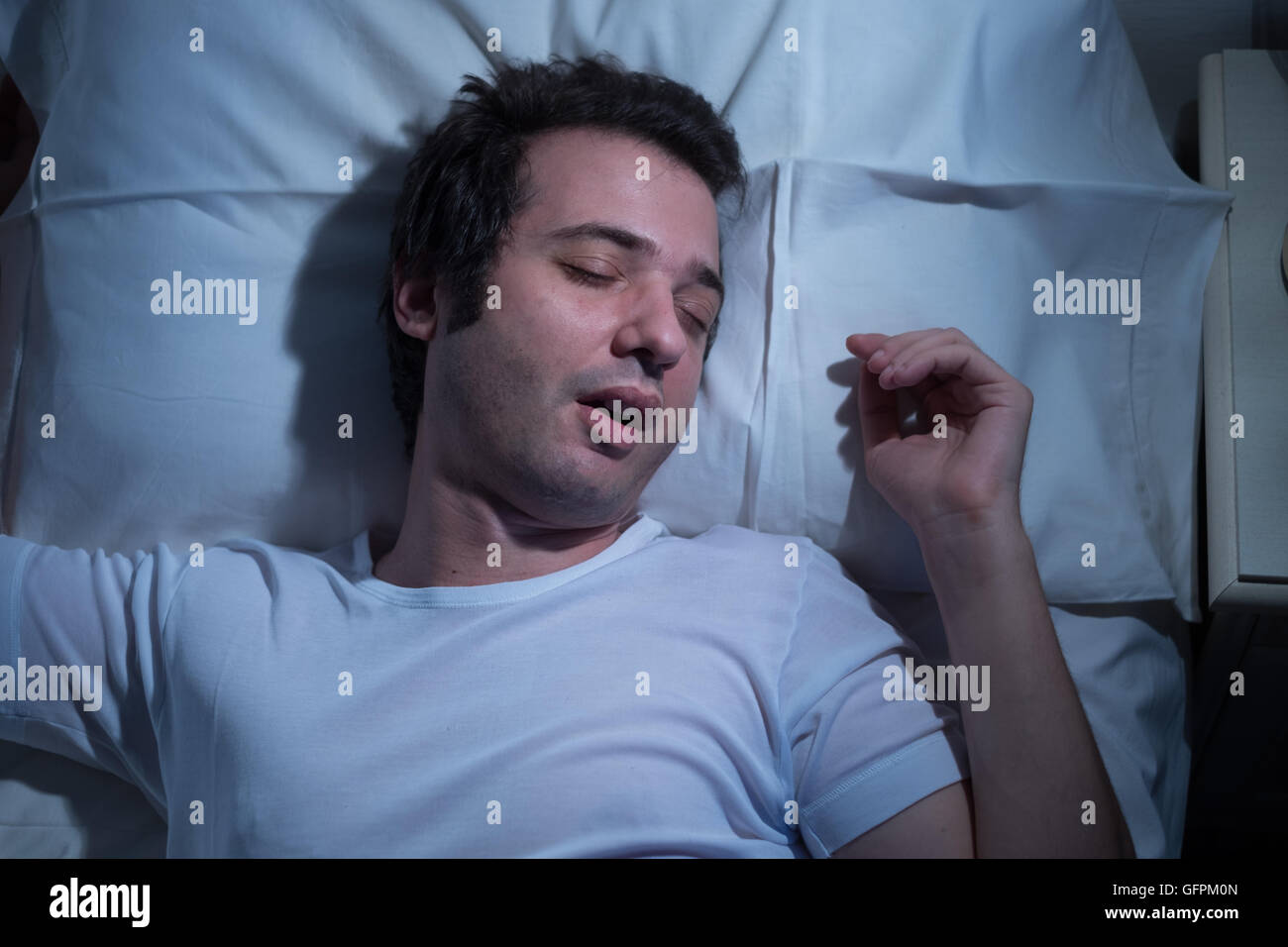 Man sleeping bed night hi-res stock photography and images - Alamy