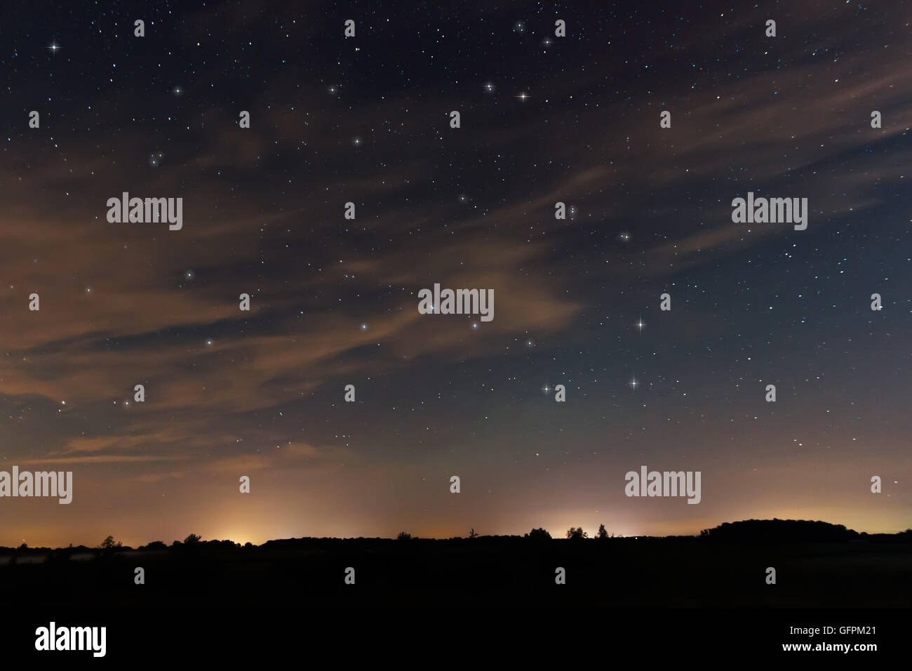 Beautiful night sky, with clouds and constellations, Hercules, Draco ...