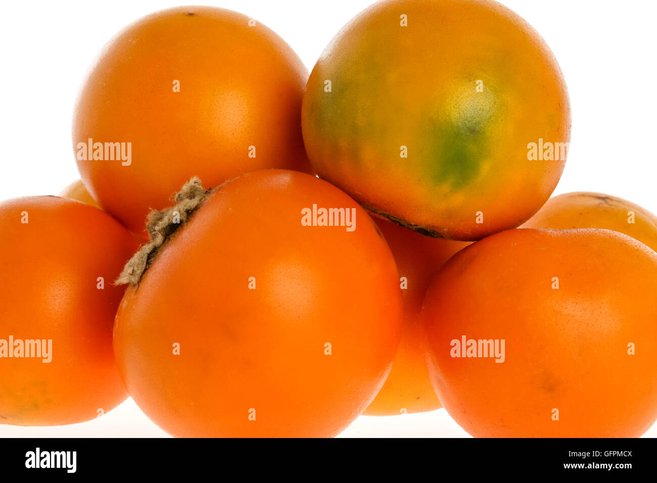 Lulo (Solanum quitoense) isolated in white background Stock Photo - Alamy