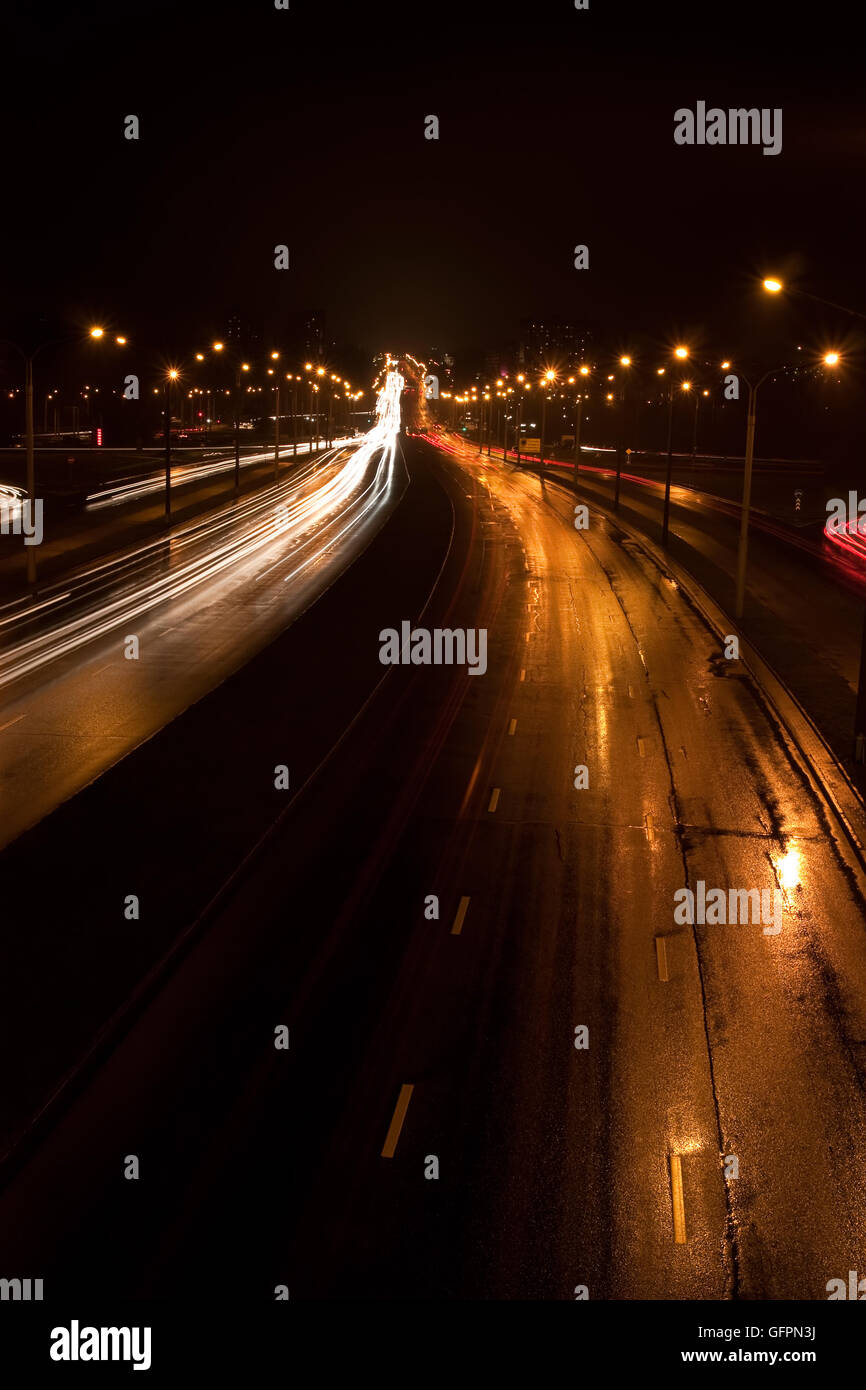 A night time shot of speeding traffic on a road Stock Photo - Alamy