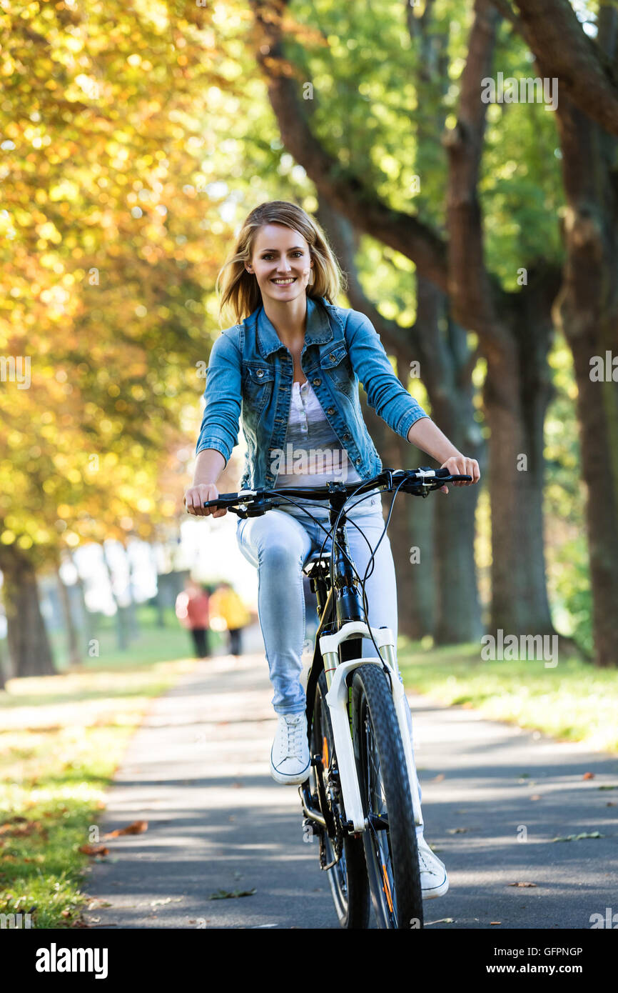 Cute girl riding mountain bike hi-res stock photography and images - Alamy