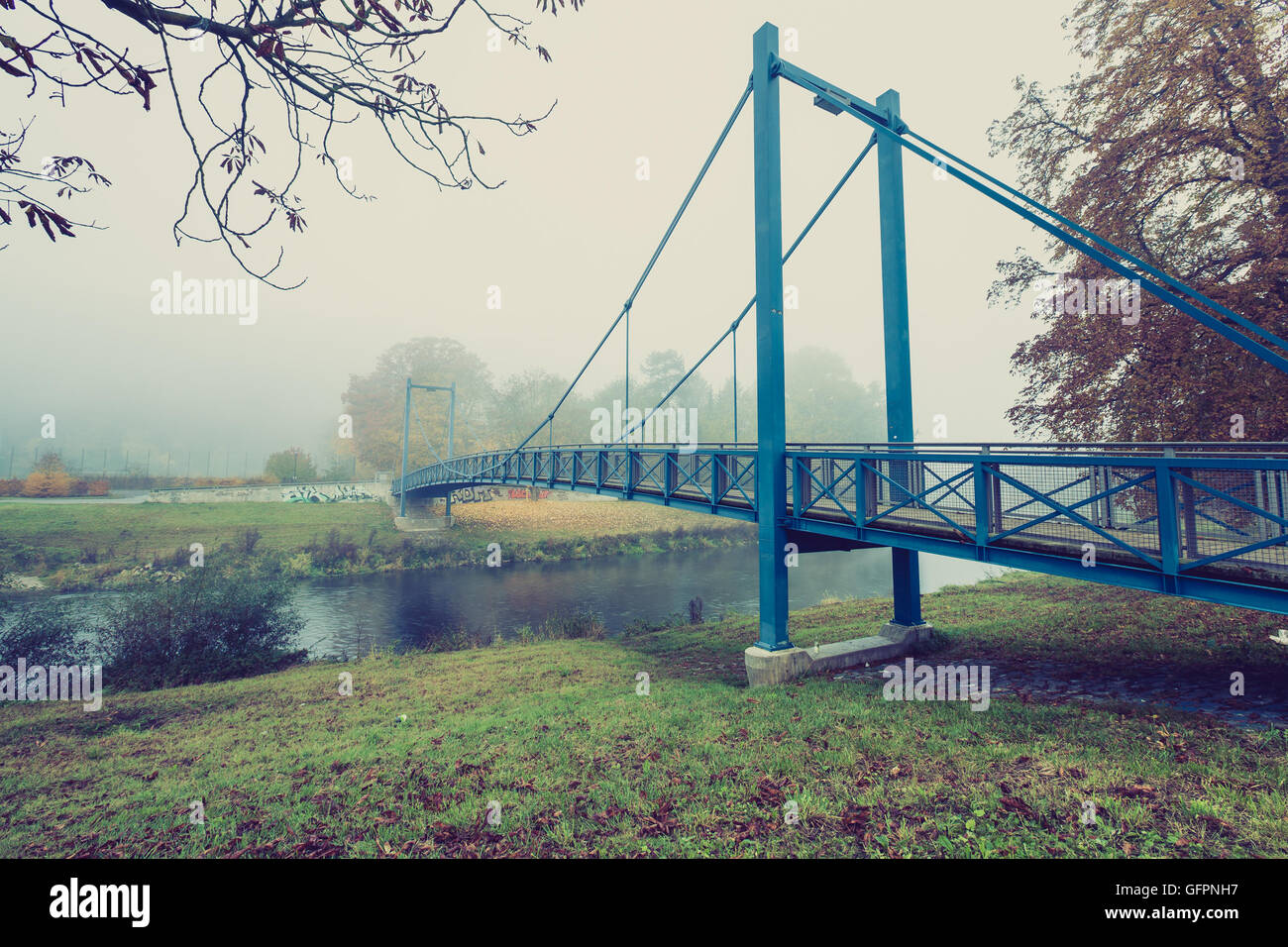 Bridge in fog. Toned photo Stock Photo - Alamy