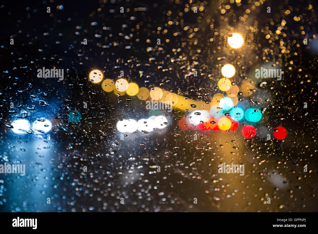 blurred traffic viewed through a car windscreen covered in rain Stock ...