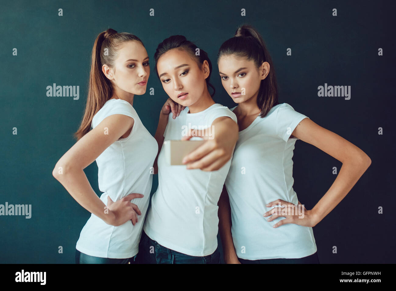 Positive friends portrait of happy girls making selfie, sure funny ...