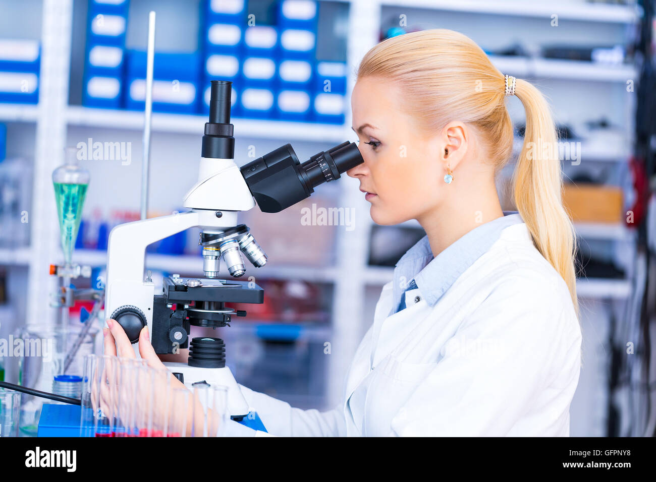 Scientist using microscope laboratory hi-res stock photography and ...