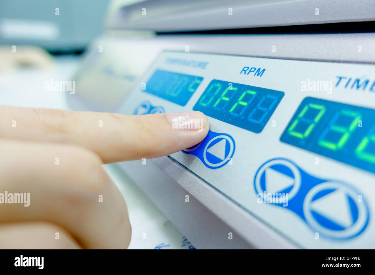 finger, pressing the button of the modern device Stock Photo - Alamy