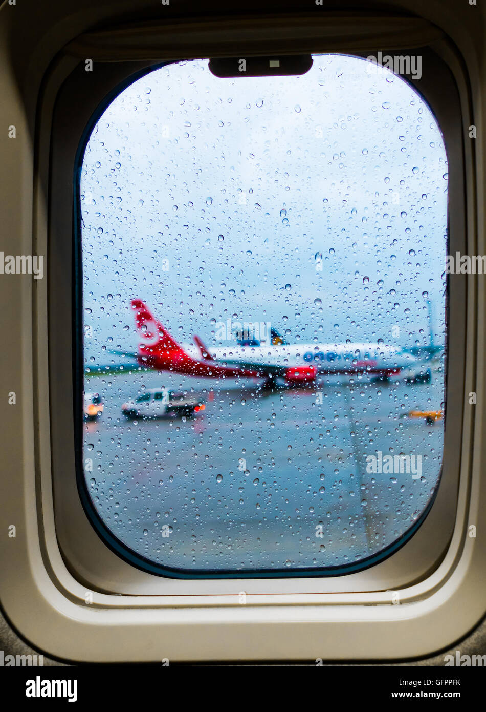 View of the aircraft through the window with raindrops Stock Photo - Alamy