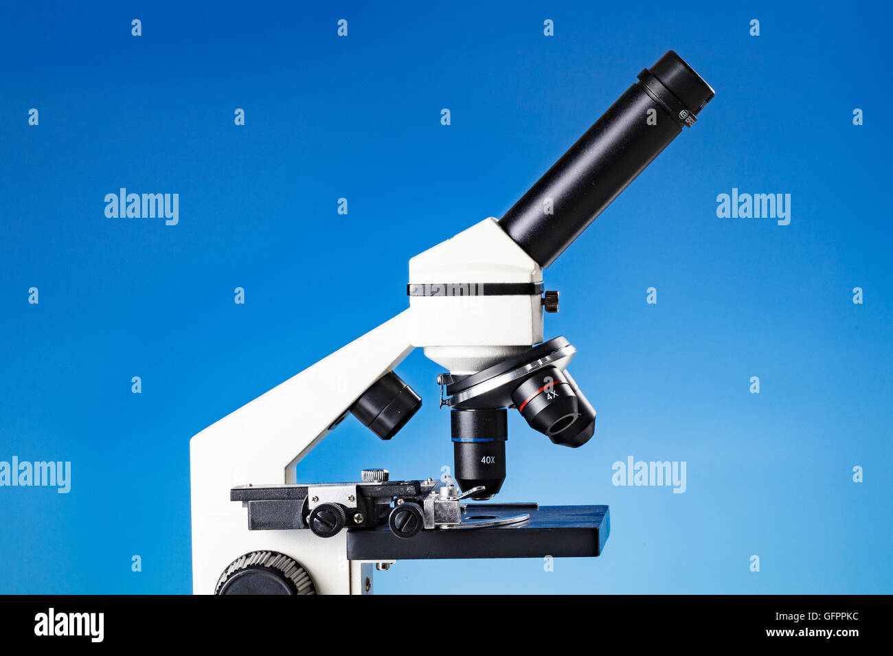 Educational microscope on blue Stock Photo - Alamy