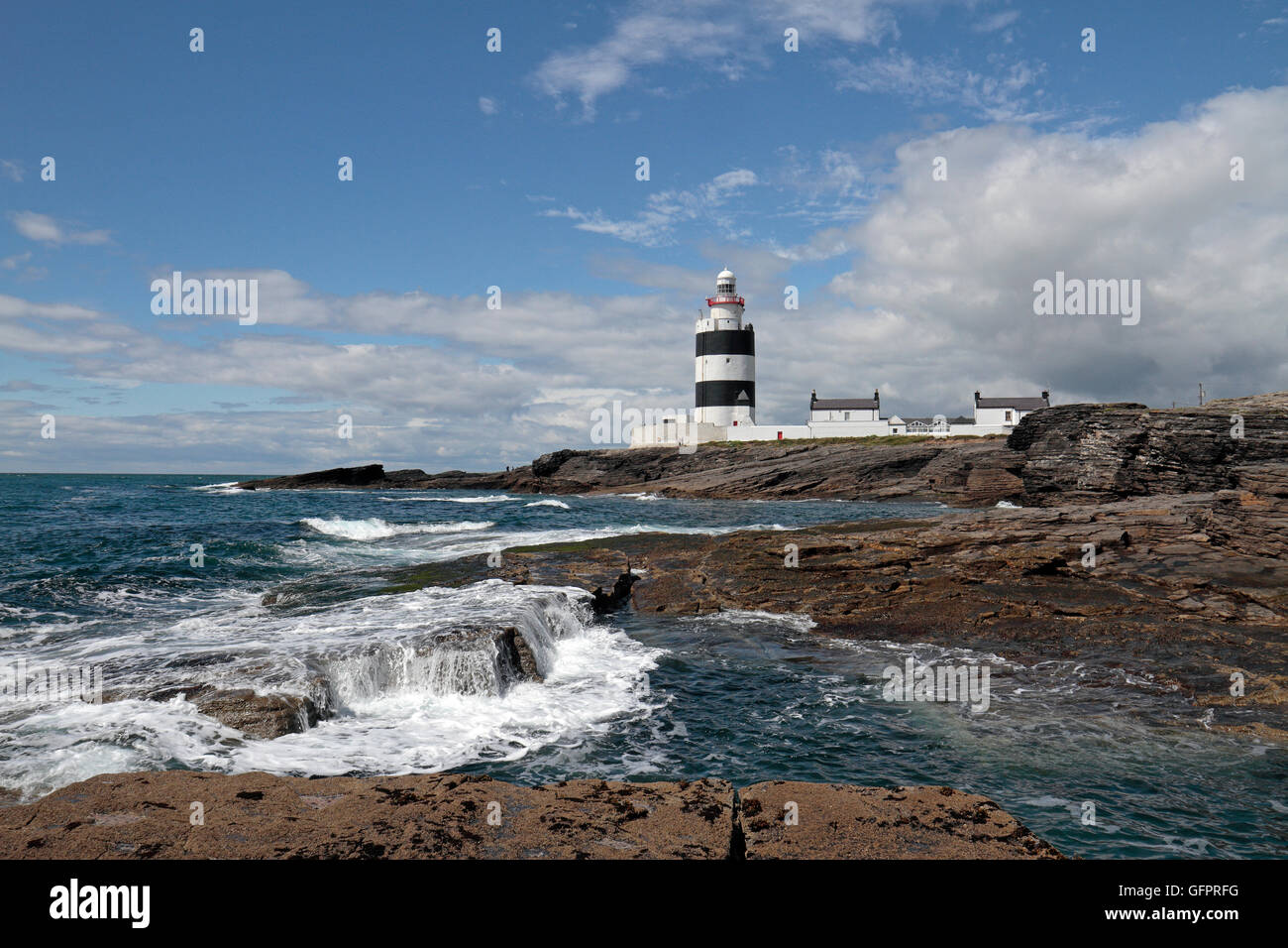 The Hook lighthouse on a rocky outcrop of the Hook Peninsula, Co ...