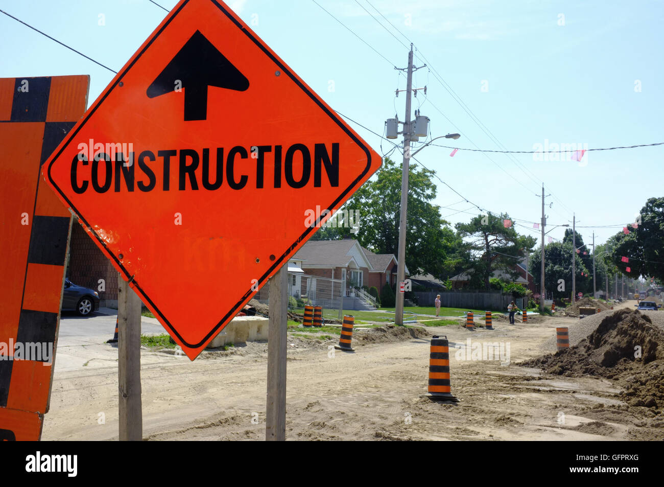 A Construction sign in front of a road being resurfaced in London ...
