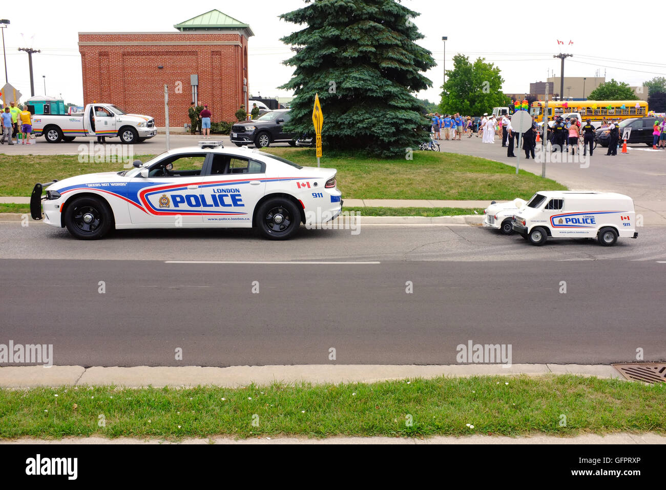 Large and small Canadian police vehicles at a Pride event in London ...