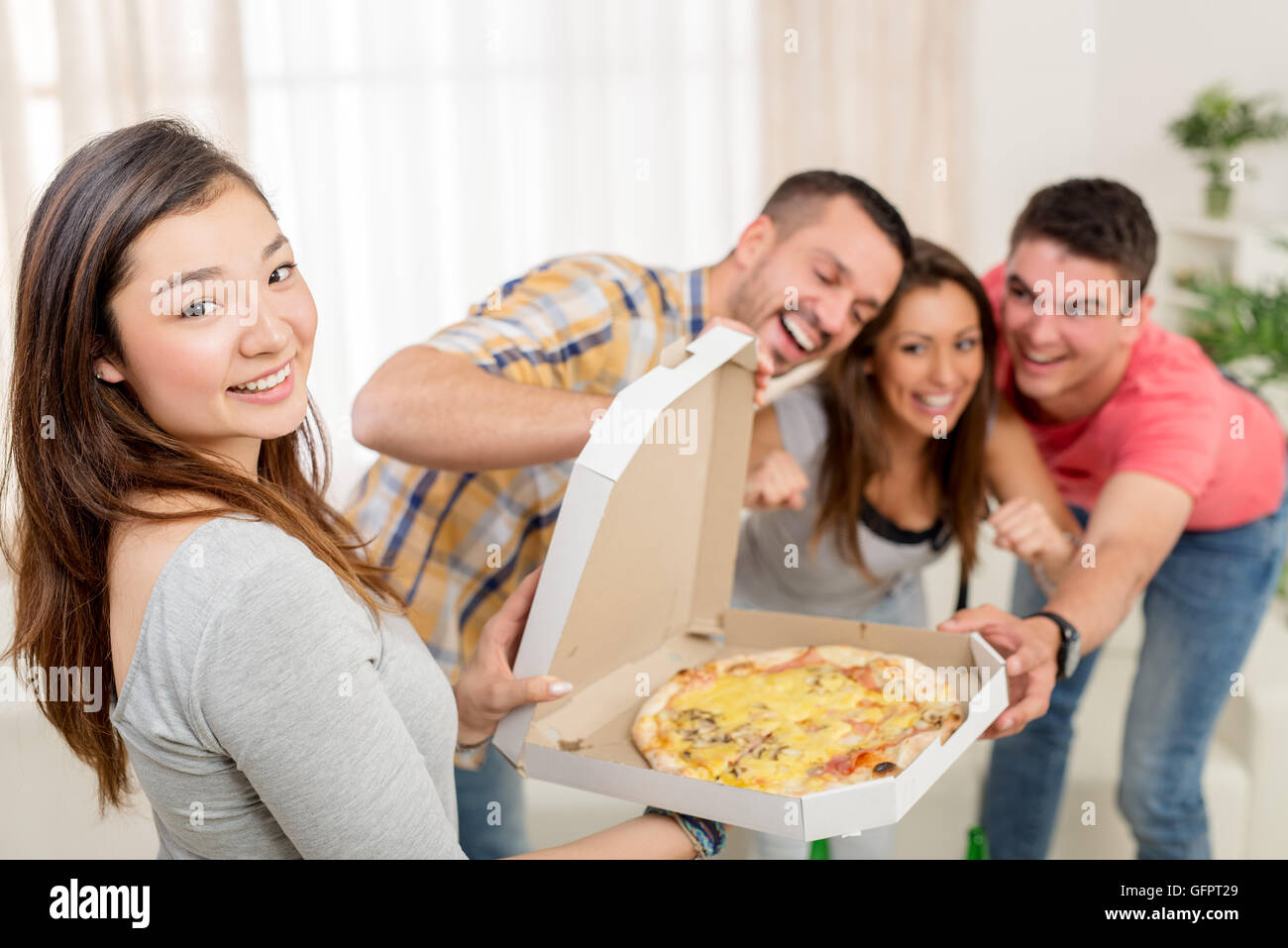 Group men women pizza hi-res stock photography and images - Alamy