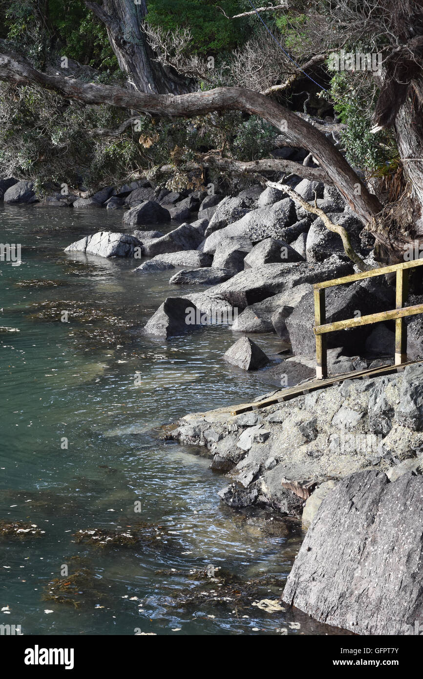 dinghy ramp shallow water boulders Stock Photo - Alamy