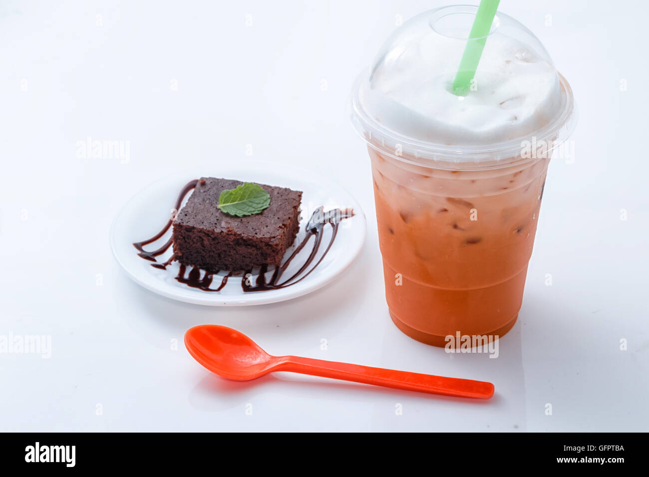 Green tea with chocolate cake on white background Stock Photo - Alamy