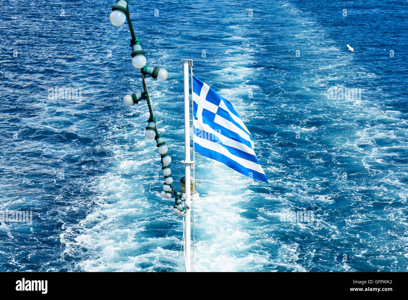 The Greek national flag flying from the stern of a ferry boat Stock ...