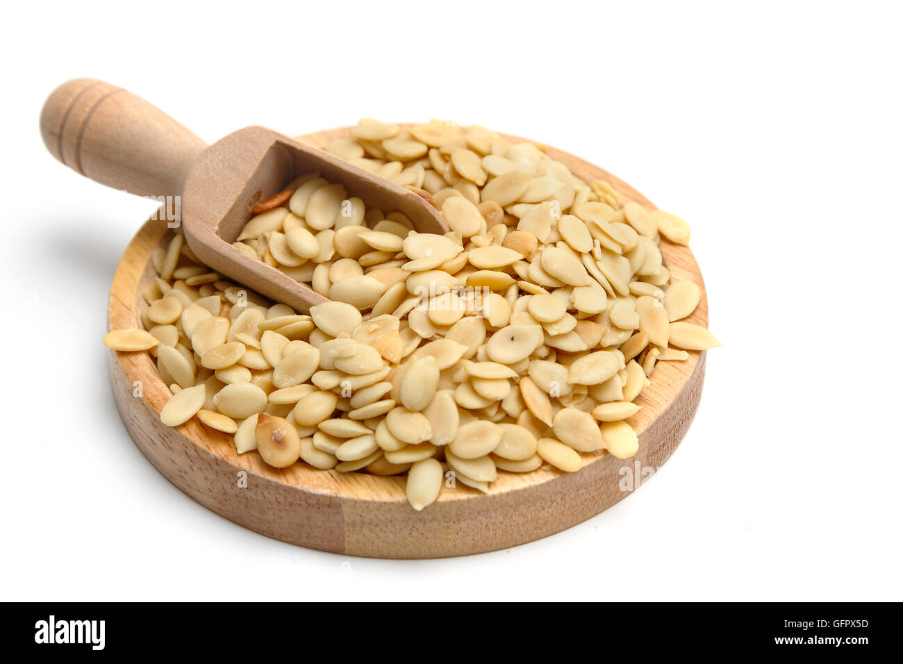 Shelled melon seeds with salt on white background Stock Photo - Alamy