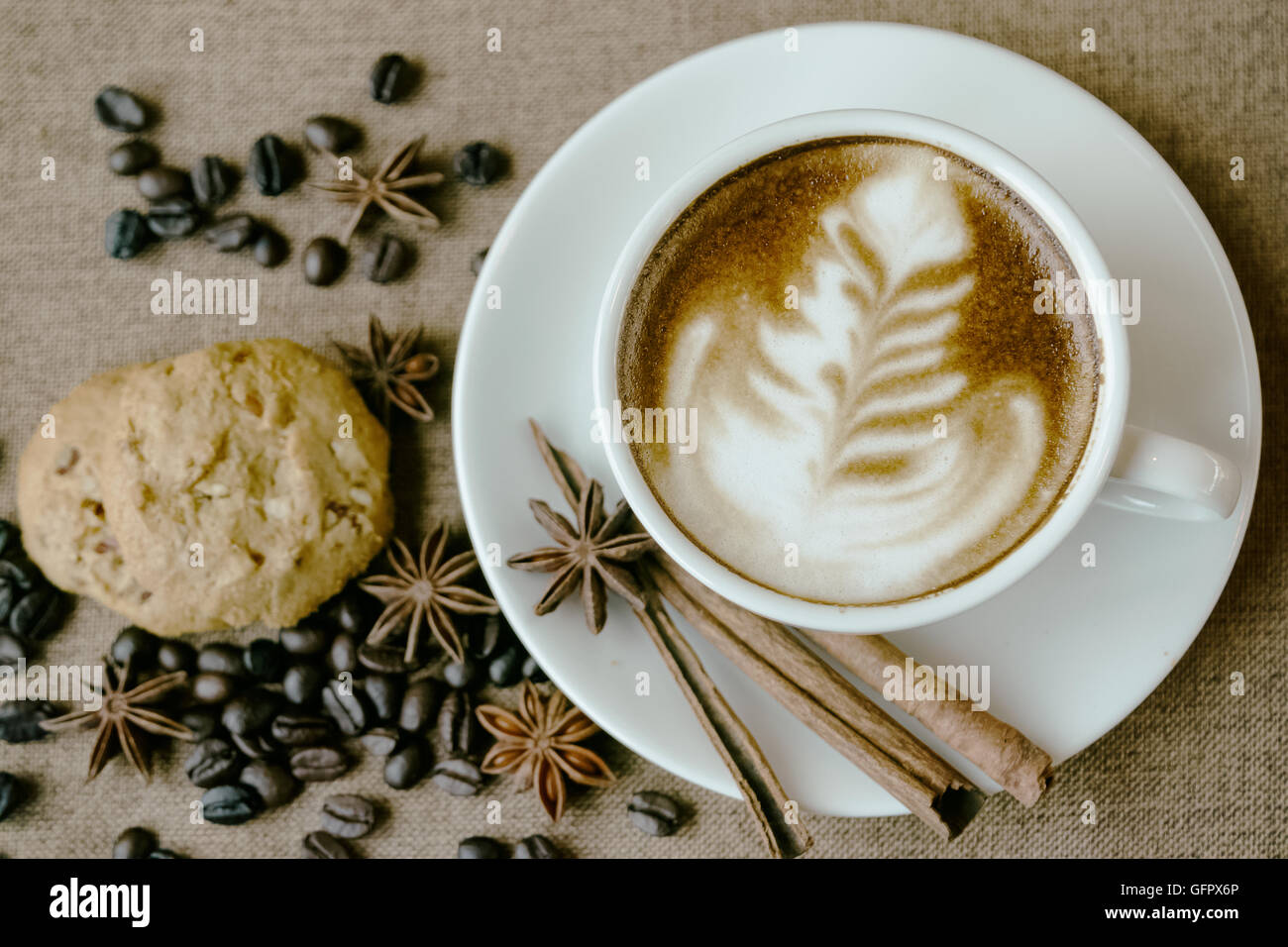 cup of coffee and cookie in coffee shop vintage color Stock Photo - Alamy