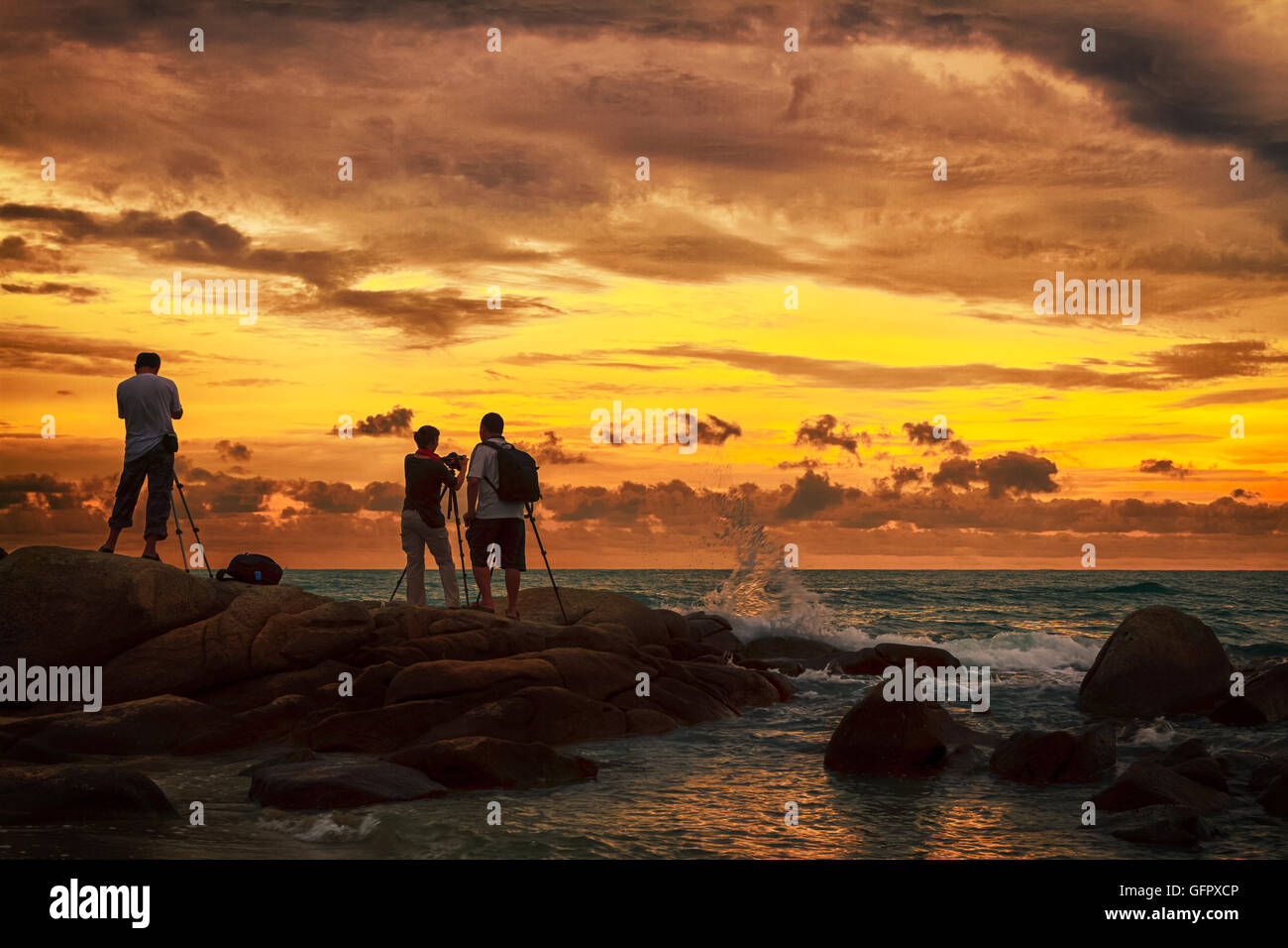 Silhouette man taking pictures sunset hi-res stock photography and ...
