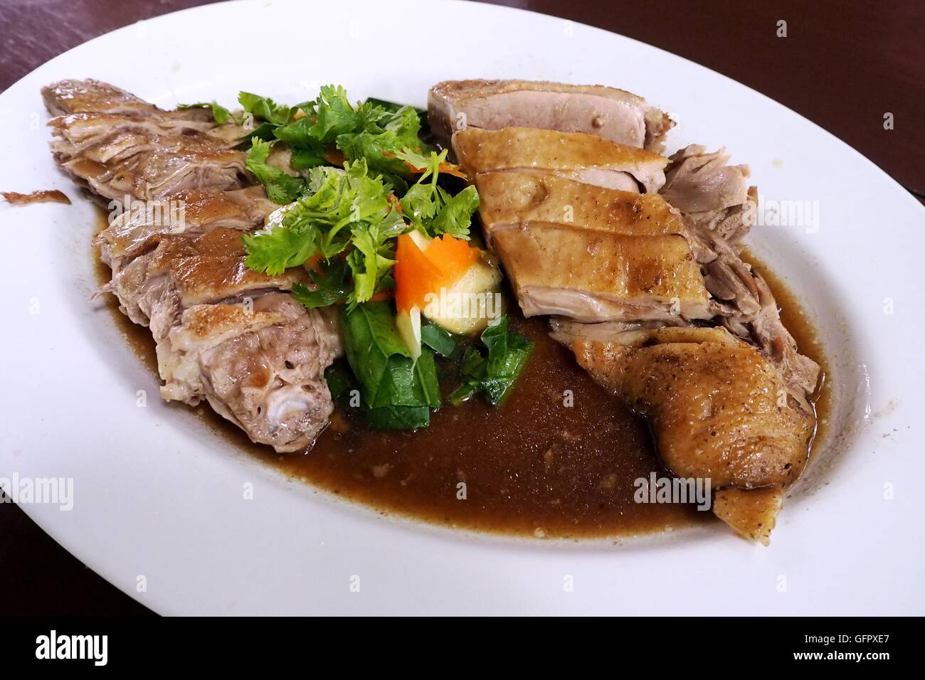 Steam duck on white plate Stock Photo - Alamy