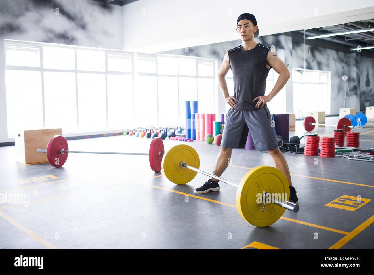 Young Chinese man exercising at gym Stock Photo - Alamy