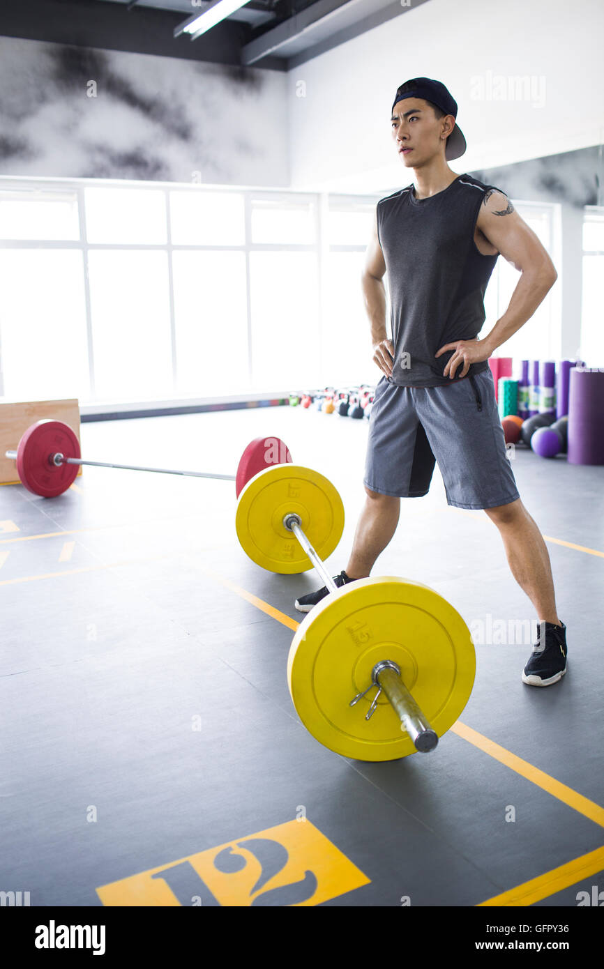Young Chinese man exercising at gym Stock Photo - Alamy