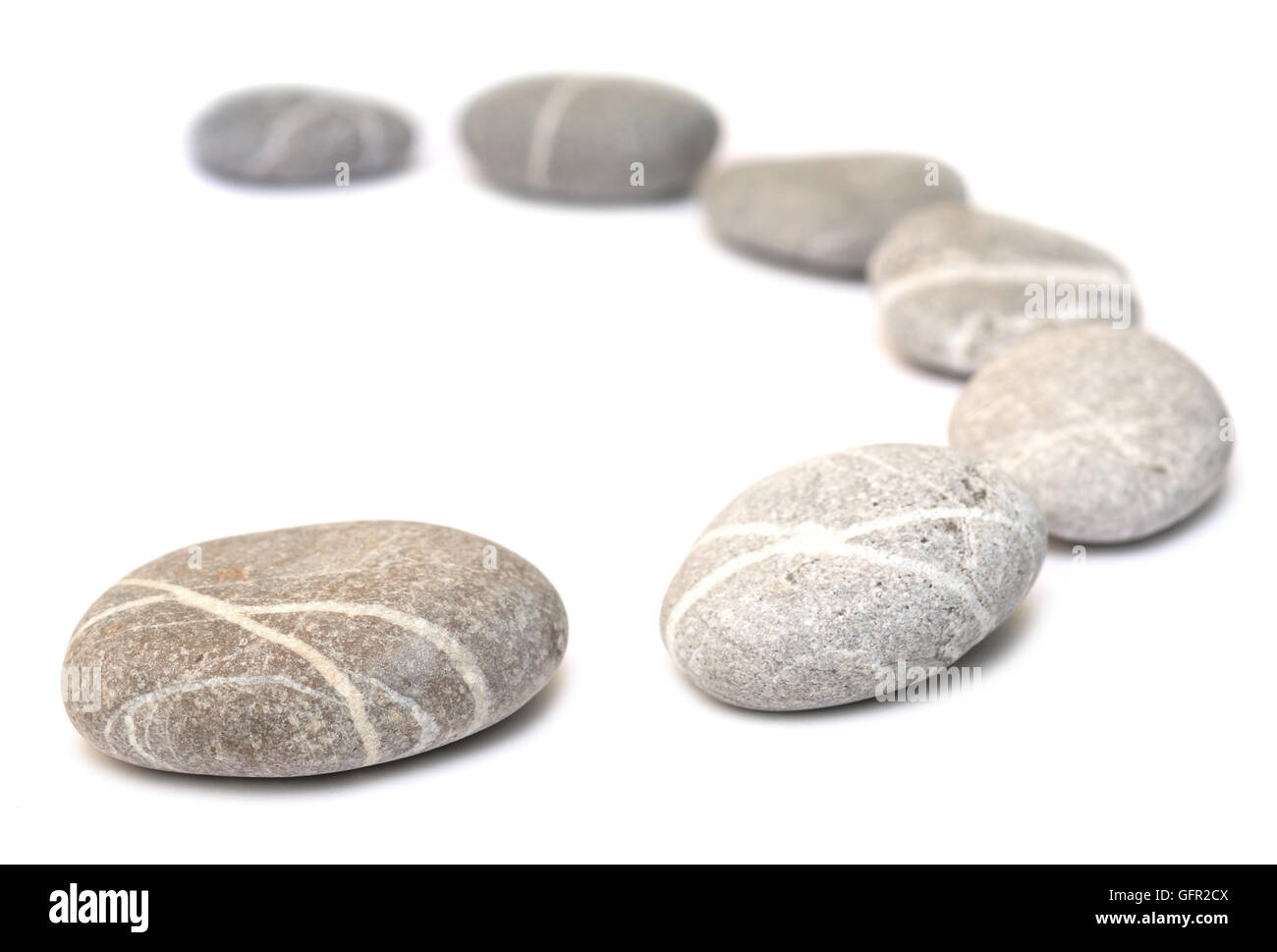 row of pebbles isolated on white background Stock Photo - Alamy