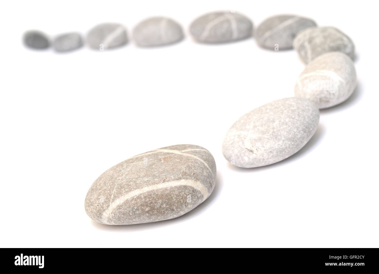 row of pebbles isolated on white background Stock Photo - Alamy