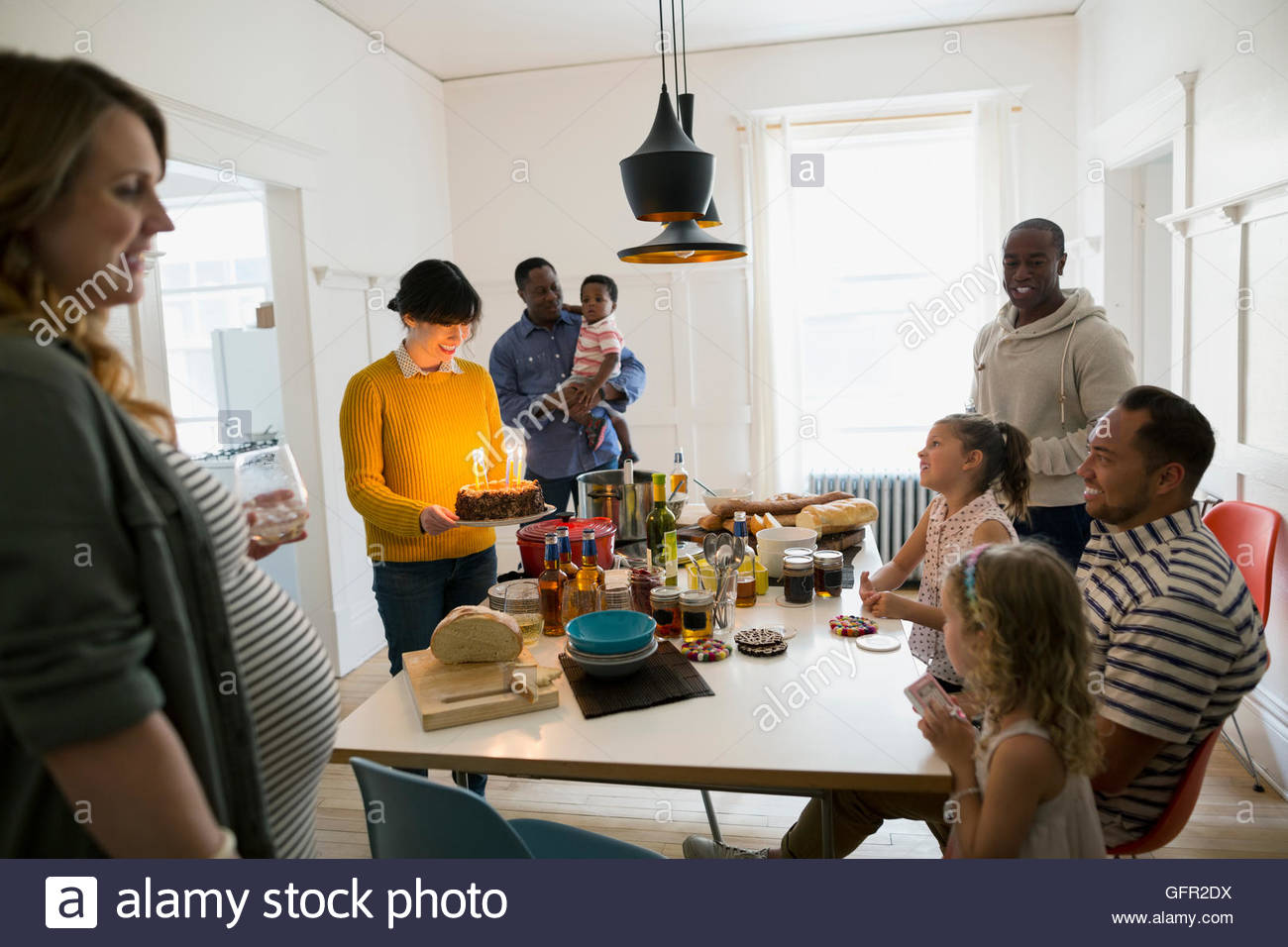 Woman serving birthday cake at party Stock Photo - Alamy