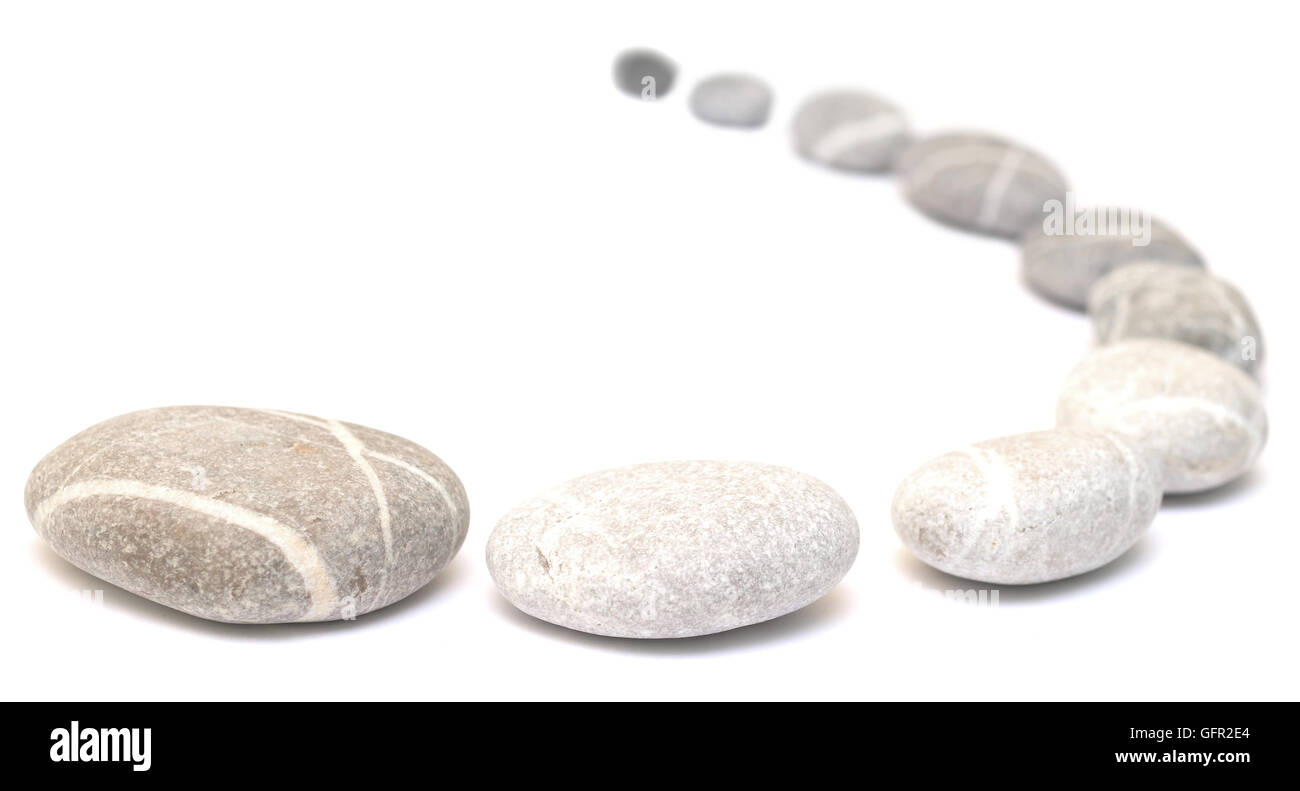 row of pebbles isolated on white background Stock Photo - Alamy