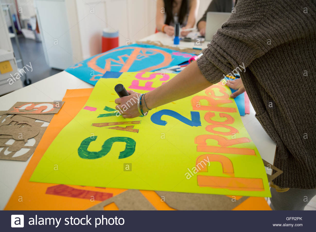 Young people with posters hi-res stock photography and images - Alamy
