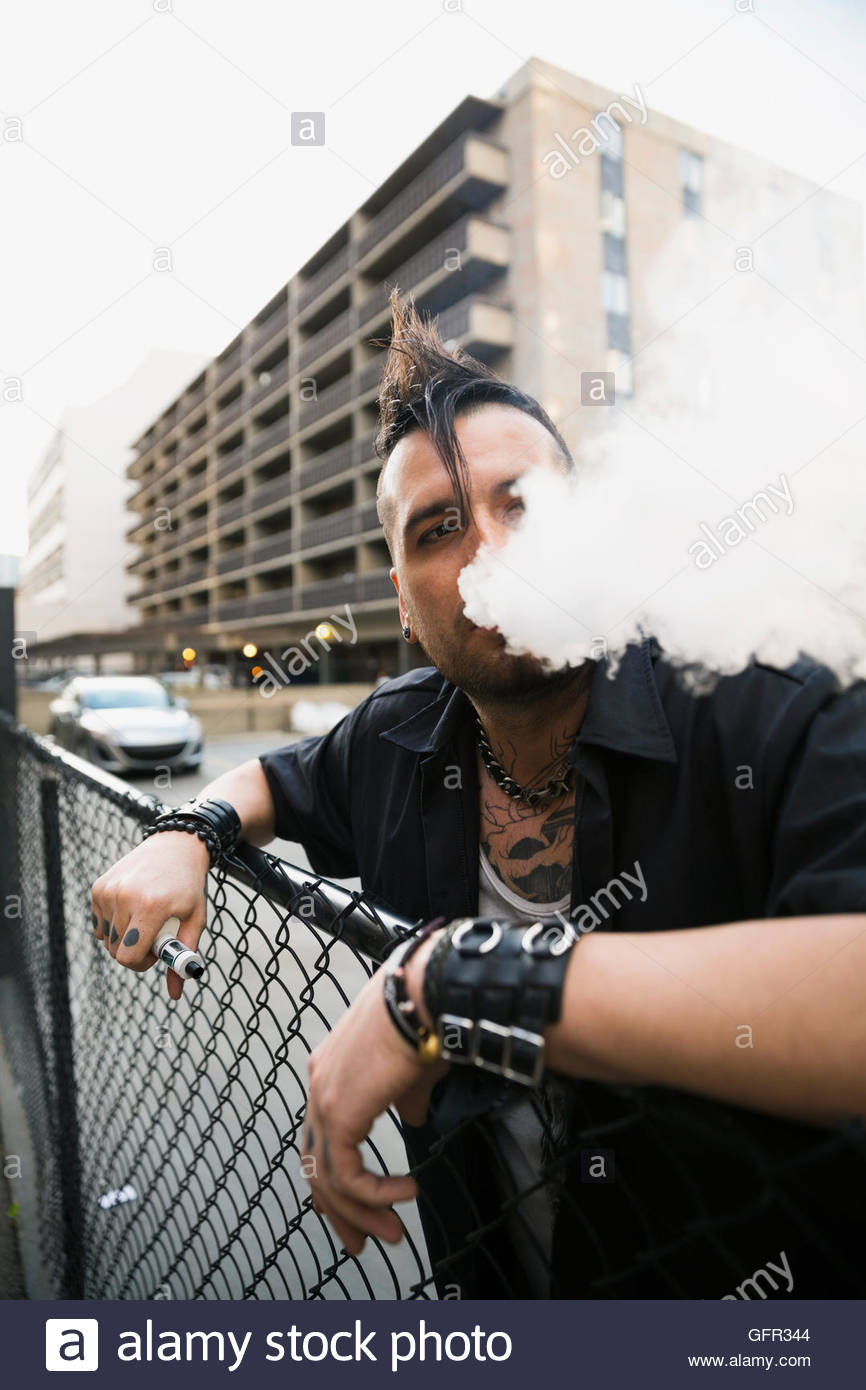 Man smoking cigarette attitude hi-res stock photography and images - Alamy