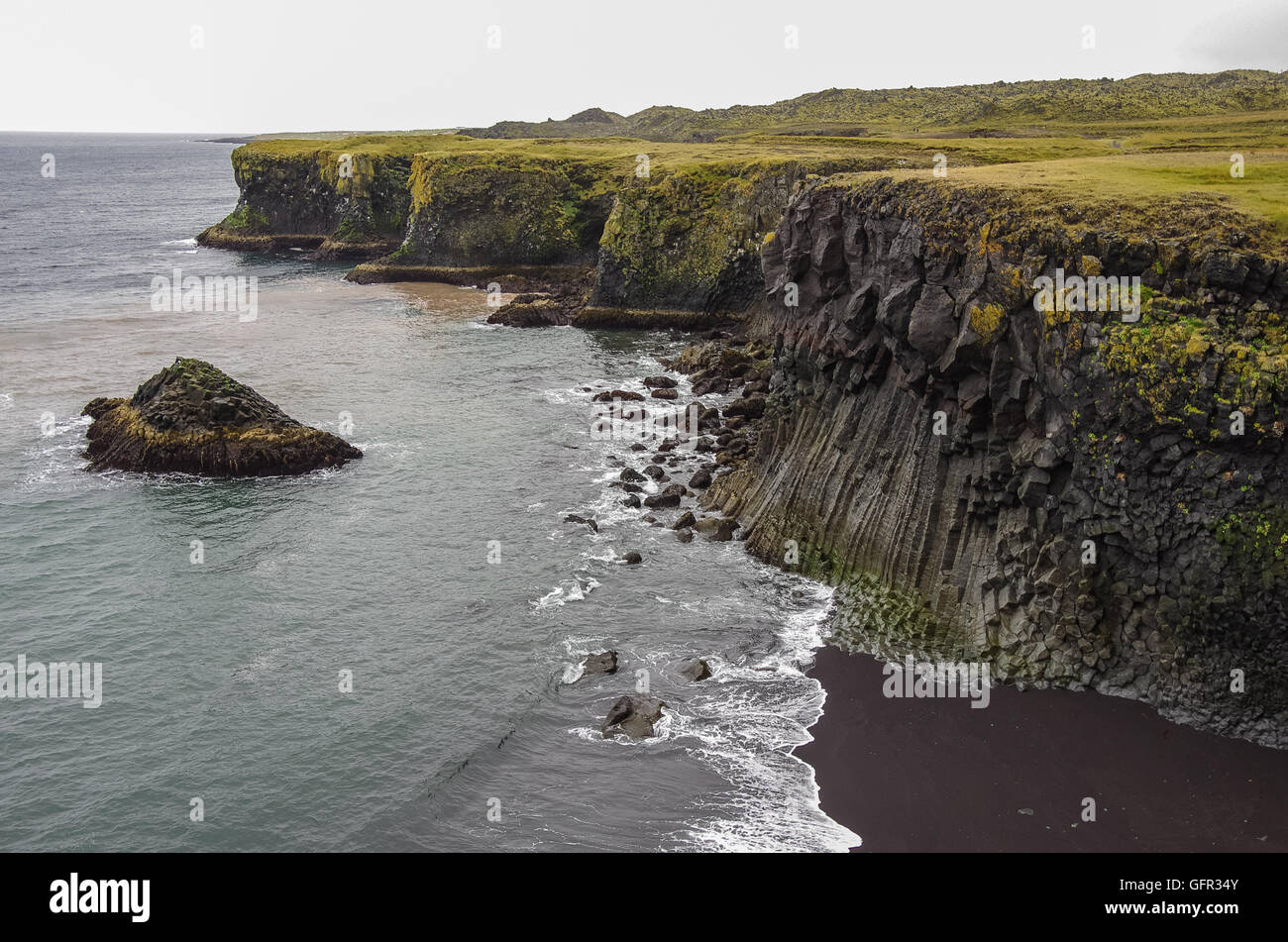 Atlantic ocean and black rock cliff of western Iceland coast ...