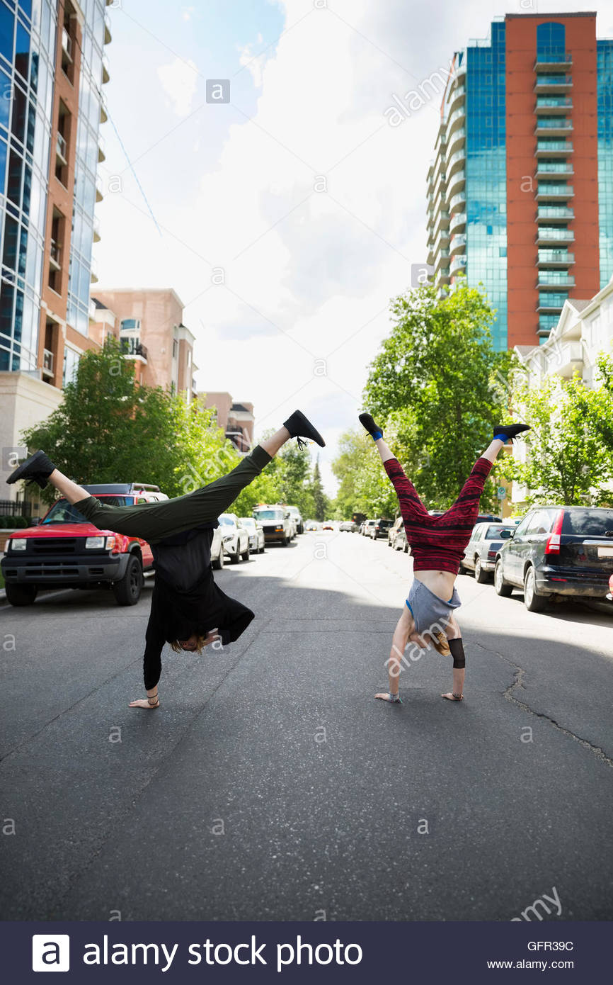Young man doing handstand in hi-res stock photography and images - Alamy