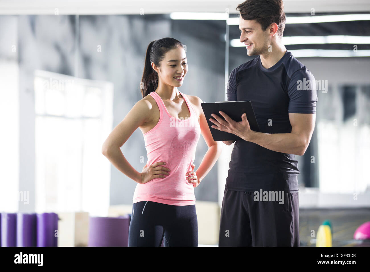 Young asian fitness instructor talking hi-res stock photography and ...