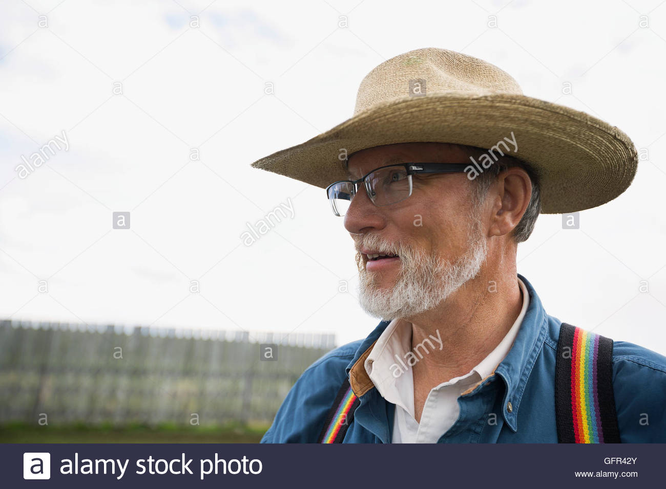 Senior cattle rancher in cowboy hat and suspenders Stock Photo - Alamy