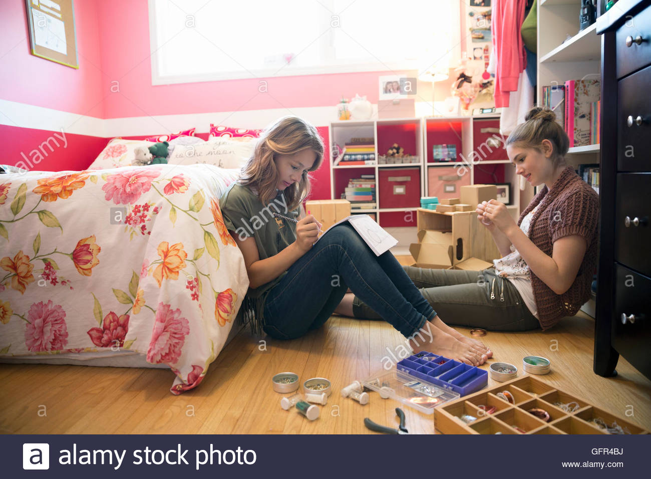 Girls making jewelry in bedroom Stock Photo - Alamy