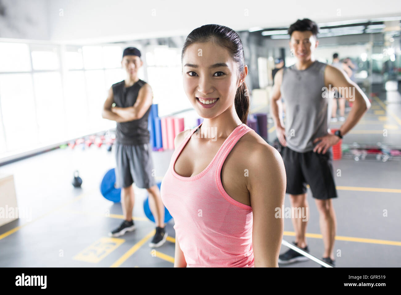 Portrait of young Chinese woman at gym Stock Photo - Alamy
