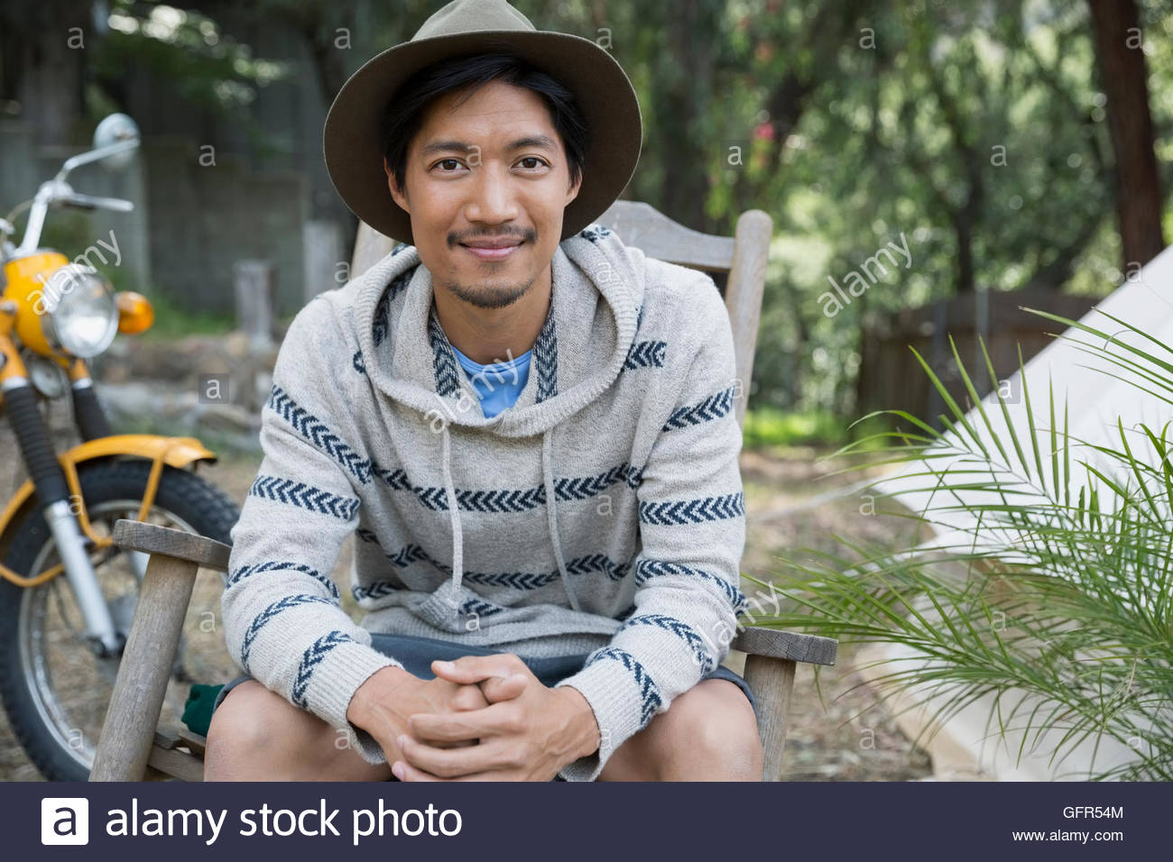 Portrait smiling man in rocking chair Stock Photo - Alamy