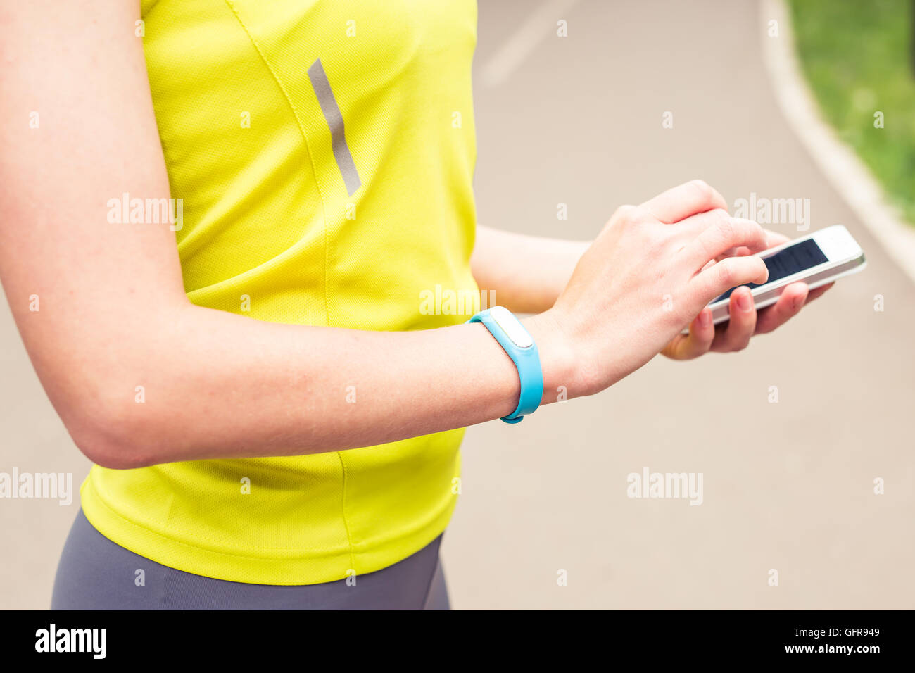 Hand wearing a fitness tracking armband Stock Photo - Alamy