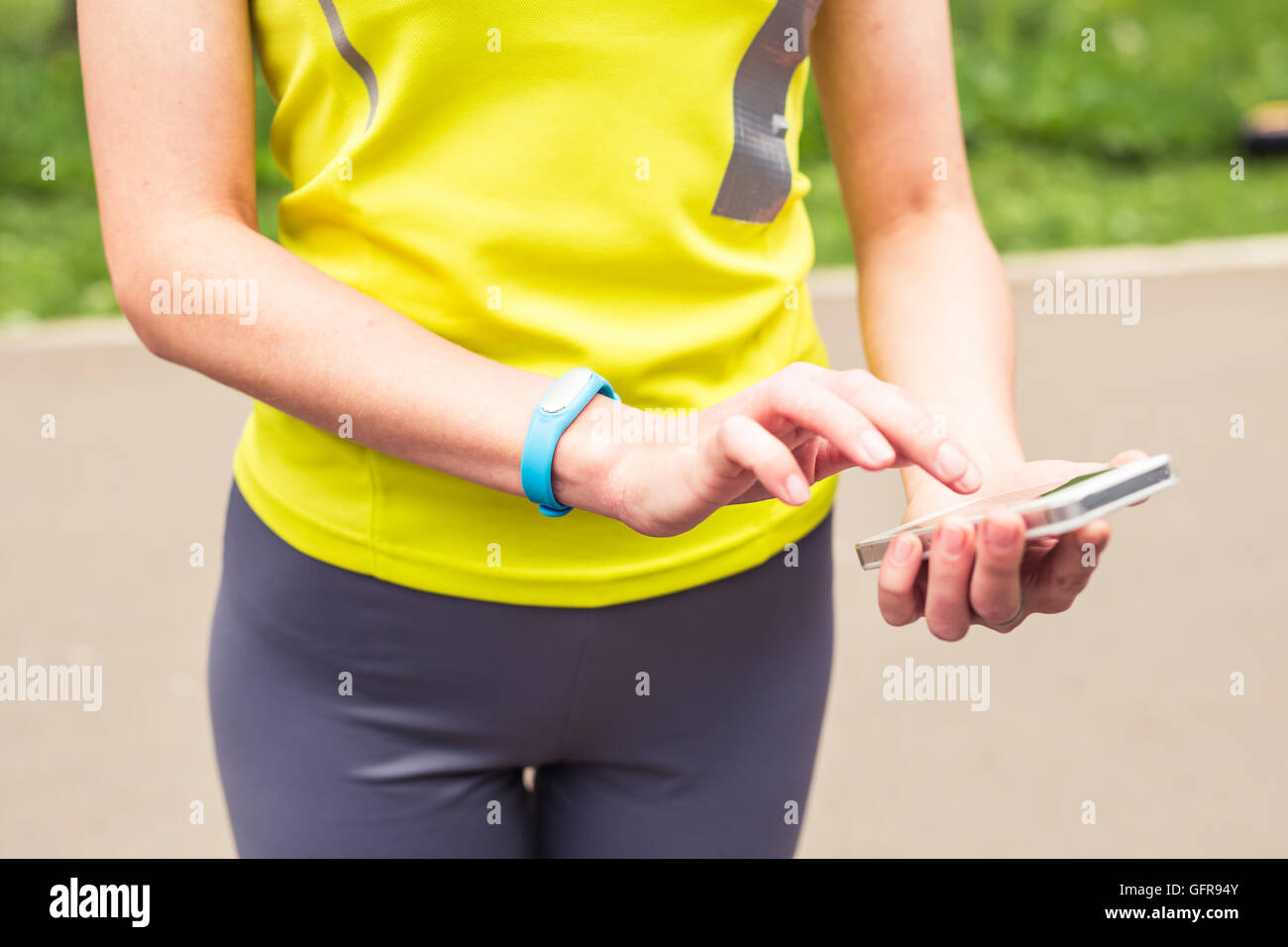 Hand wearing a fitness tracking armband Stock Photo - Alamy
