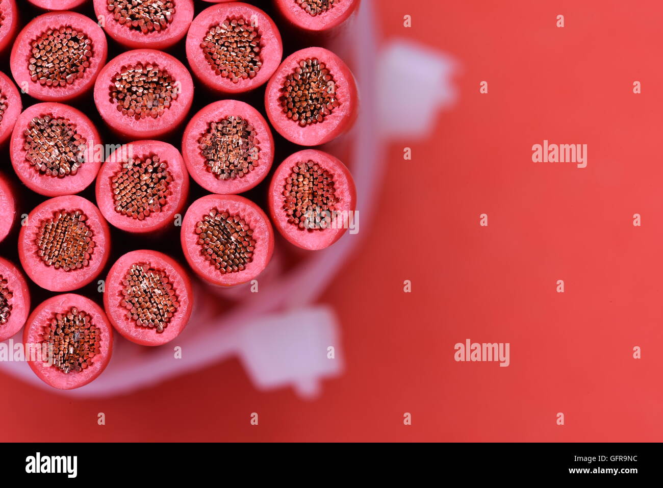 Group of red electric cables closeup Stock Photo - Alamy